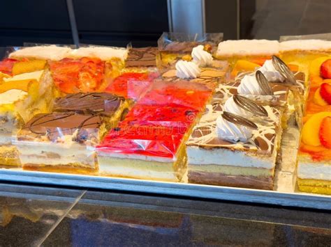 Assorted Pastries On Display Cake Slices With Chocolate Fruit And