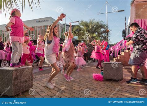 Young Girls In Pink Dance At Breast Cancer Awareness Rally Editorial