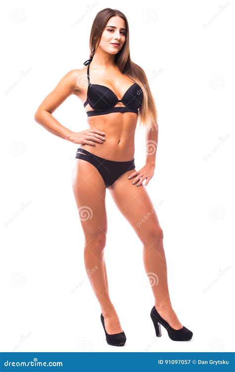 Young Woman Posing In A Black Bikini Isolated On White Background Stock