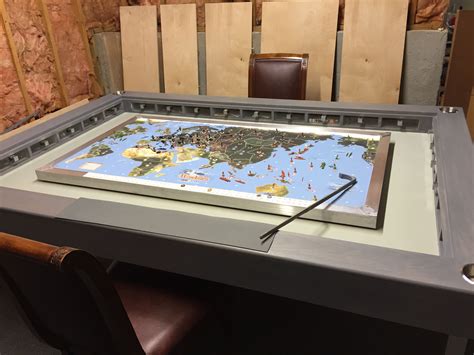 Game Table With Recessed Playing Surface And Movable Map Axis