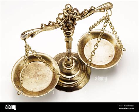 Ornate Brass Justice Scales On A Light Isolated Background 3d Render