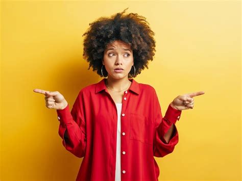 A Woman Pointing At Something With Her Fingers Pointing Up Premium Ai Generated Image