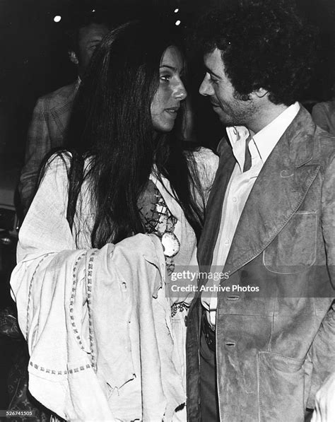 Singer Cher Looking Into The Eyes Of Businessman David Geffen At An