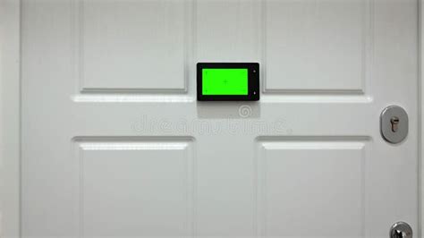 Green Video Screen Of A Peephole Or Intercom On The Front Door Video Surveillance System For