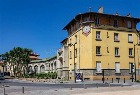 Historical Building On A Corner With A Clock In Carcassonne Southern