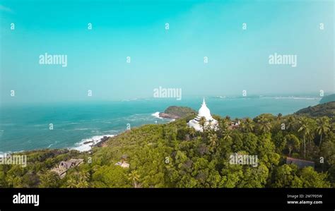 An An Aerial Shot Over The Rumassala Sanctuary Near A Jungle Beach