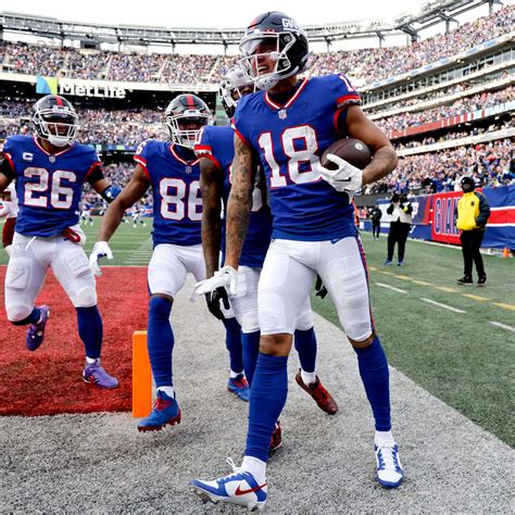 Download Football Player Celebrating Touchdown Wallpaper