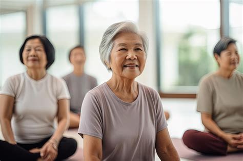 Premium Photo A Group Of Older Women Sitting In A Yoga Class