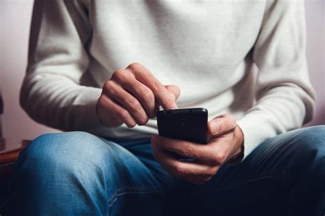 Premium Photo Man Tapping On Phone Screen
