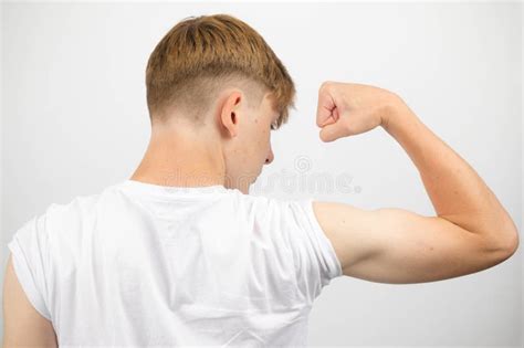 Teenage Boy Flexing His Arm Muscles Stock Image Image Of Exercise