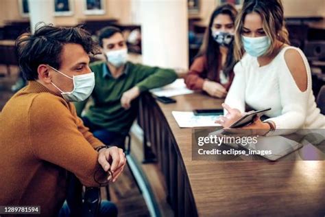 Crowd Around Desk Photos And Premium High Res Pictures Getty Images