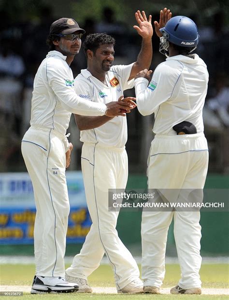 Sri Lankan Cricketer Muttiah Muralitharan Celebrates With Captain