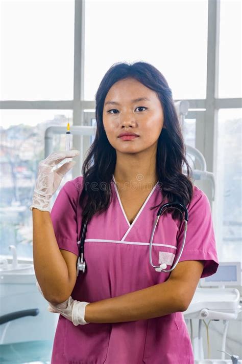 Confident Beautiful Indian Looking Nepali Dentist Doctor Girl Smiling