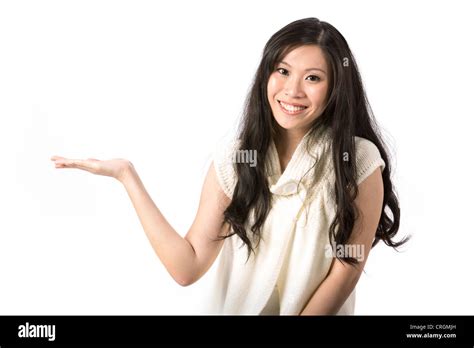 Happy Asian Woman Holding Out Her Hand To Show Your Message Isolated