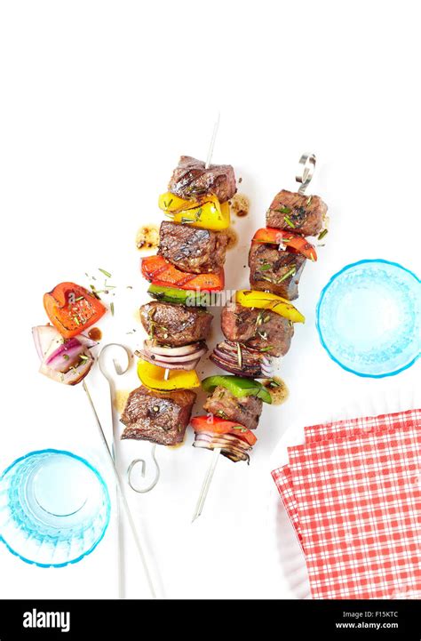 Grilled Beef Vegetable Skewers Turquoise Drinking Glasses With Red And