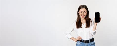 Free Photo Happy Smiling Woman Showing Smartphone App Interface Mobile Phone Screen