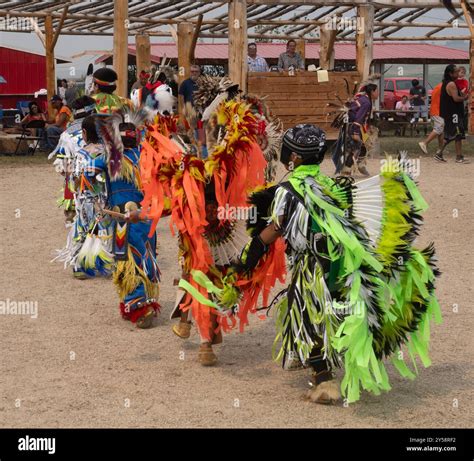Native American Boys Dressed In Fancy Dancer Costumes Dancing At A