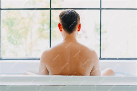 Premium Photo Back Of Asian Man Showering In The Bathtub