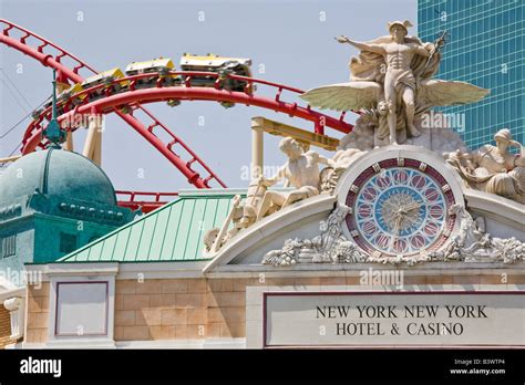A Roller Coaster Whisks Passengers Past The Entrance To The New York