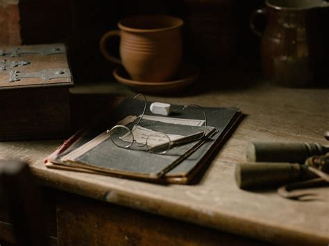 Premium Photo The Ancient Old Diary At The Table
