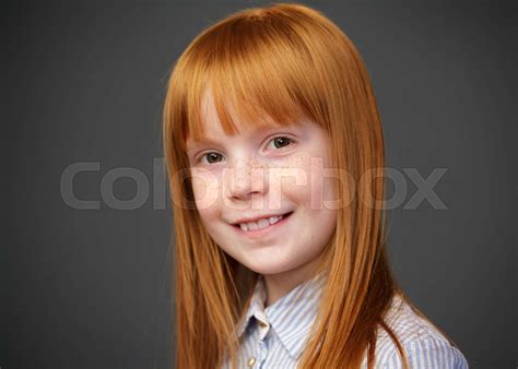 Portrait Of A Cute Ginger Girl Stock Image Colourbox