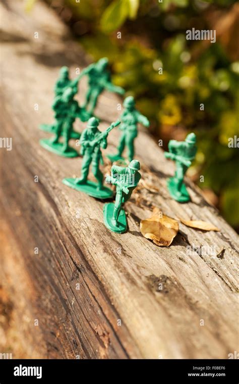 Green Plastic Toy Soldiers Army Men On A Mission In The Back Garden