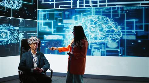 Neuroscientist Doing Demonstration At Ai Convention Using Eeg Headset
