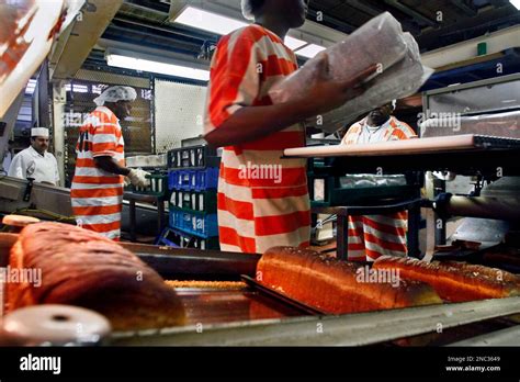 Inmates Pack Machine Sliced And Wrapped Bread At The Rikers Island Jail