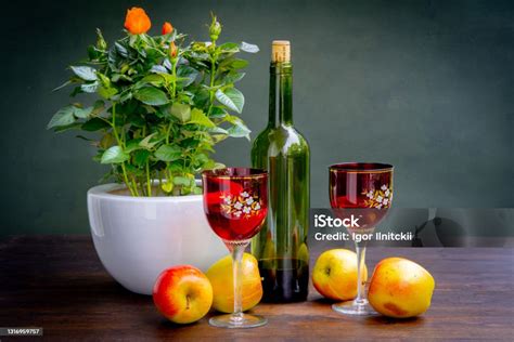 Antique Stylized Still Life With A Bouquet Of Roses A Bottle Of Wine