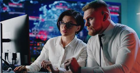 Smart Programmers Discussing Data On Computer Stock Footage Video Of