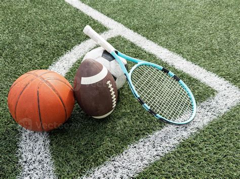Assorted Sports Equipment Including A Basketball Soccer Ball Tennis