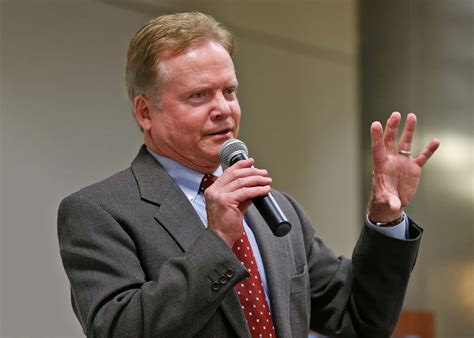 Download United States Senator Jim Webb With One Hand Raised Wallpaper