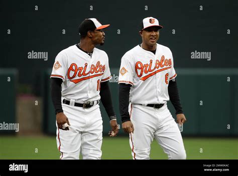 Baltimore Orioles Adam Jones Left And Jonathan Schoop Chat Before A Baseball Game Against The