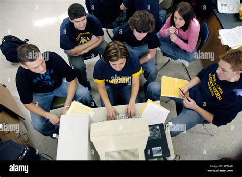 Students Work On Computers In A High School Computer Programmer Class