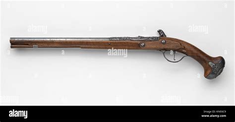 This Flintlock Pistol Dating From The 17th Century Represents A Key