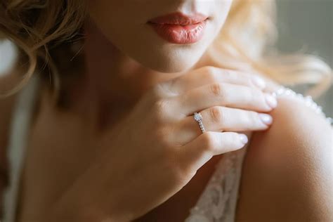 Premium Photo The Bride Gently Touches Her Dear Ring