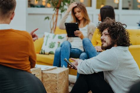 Group Of Multi Ethnic Colleagues Working On Desktop Computers Laptop And Sharing Their Ideas In