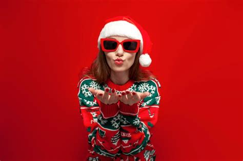Premium Photo Cute Girl In Christmas Sweater And Santa Hat In Glasses