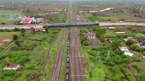 Aerial View Of Cargo Train And Highway Bridge Stock Footage Video Of