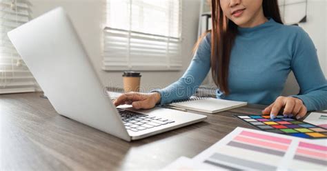 Creativity And Color Selection A Designer Analyzing Color Palettes