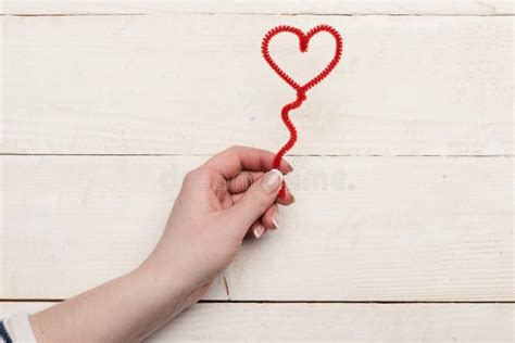 Red Fuzzy Wire Hearts And Ringlets On White Vintage Background Stock