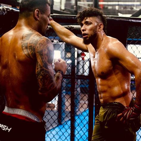 Download Johnny Walker Chatting With Fellow Fighter Wallpaper