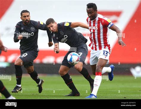 Stoke Citys John Obi Mikel Right And Brentfords Vitaly Janelt