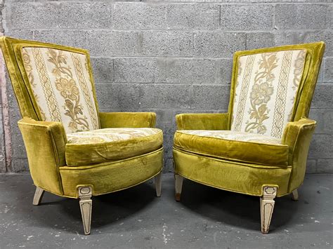 A Pair Of Hollywood Regency Upholstered Lounge Chairs By Silver Craft