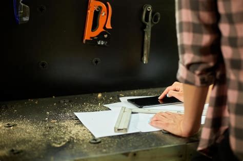 Premium Photo Female Business Owner Using Digital Tablet In Workshop