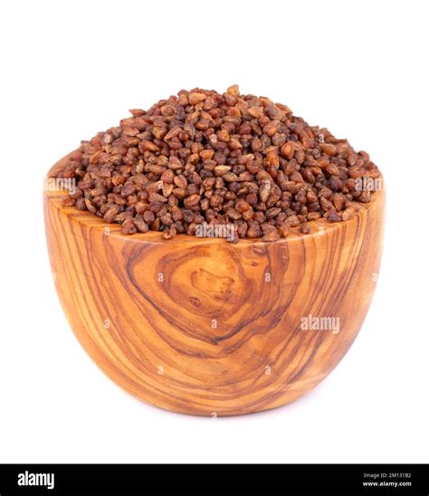 Buckwheat Tea In Wooden Bowl Isolated On White Background Whole Roasted Buckwheat Grains
