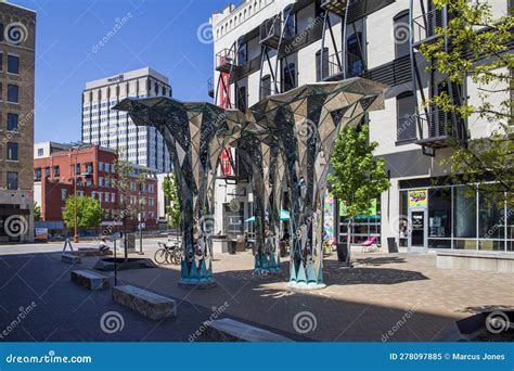 The Radiance Pavilion Sculpture In A Gorgeous Spring Landscape At Patten Square With Buildings