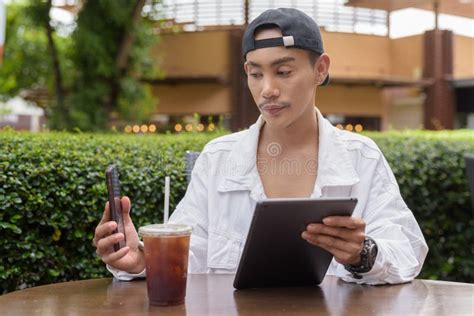 Cute Non Binary Gay Man Drinking Coffee In Outdoors Cafe Restaurant Stock Image Image Of