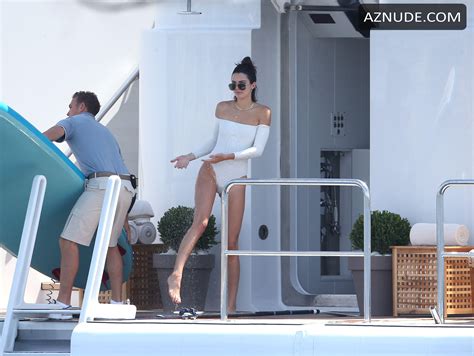 Kendall Jenner Sexy Boarding In A White Swimsuit In Cannes Aznude