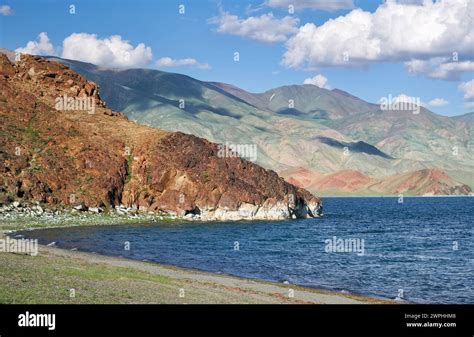 Beach On The Shore Of Mongolian Lake Tolbo Nuur Surrounded By Mountains